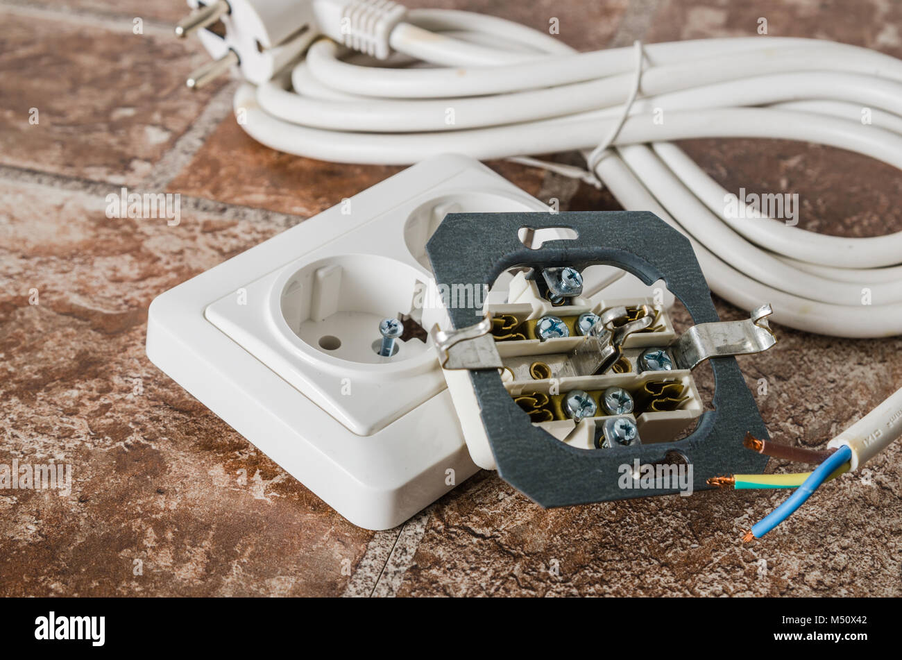 Electric socket and cable, close-up Stock Photo - Alamy