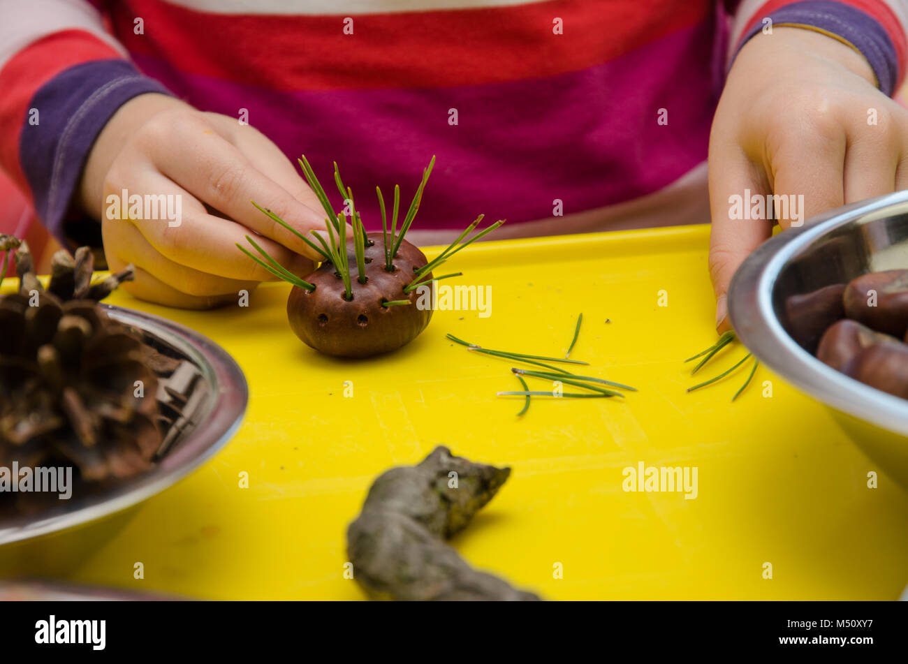 little lovely cute active kid spending time autumn craftsmaship ...