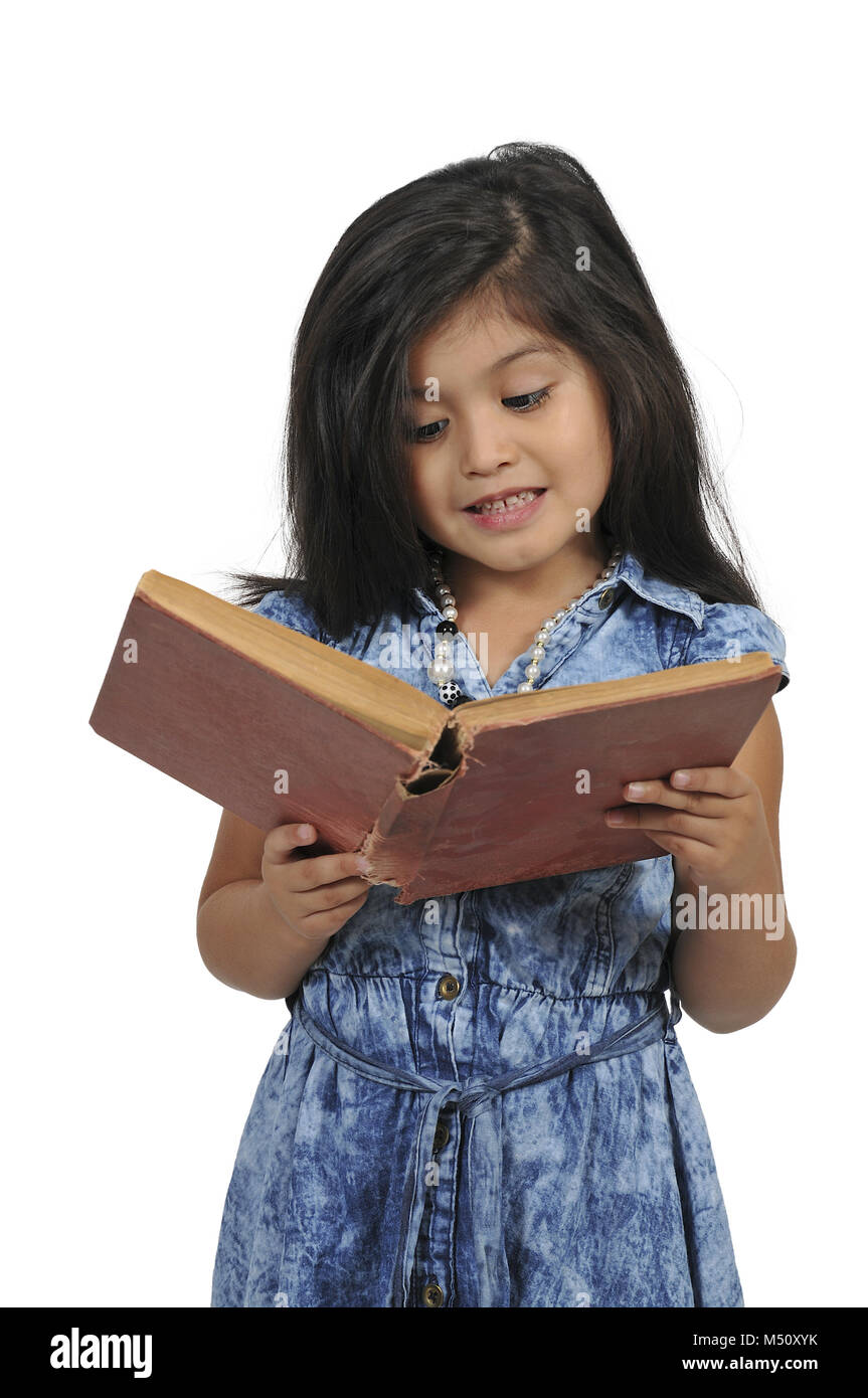Little girl holding book Stock Photo - Alamy