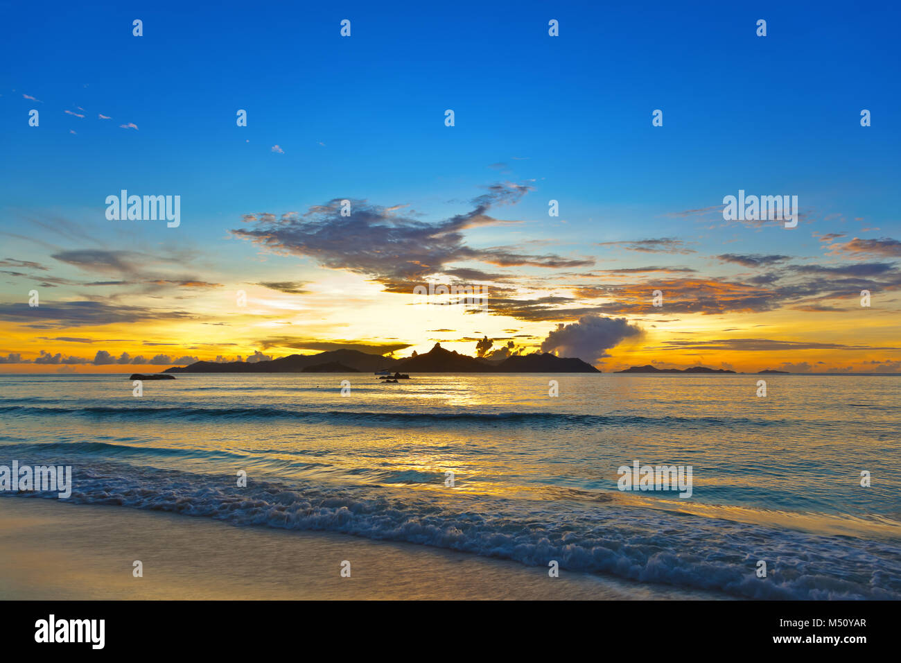 Sunset on tropical beach - Seychelles Stock Photo - Alamy