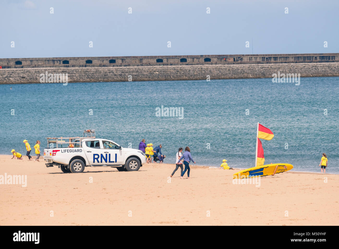 RNLI lifeguard on a beach Stock Photo - Alamy