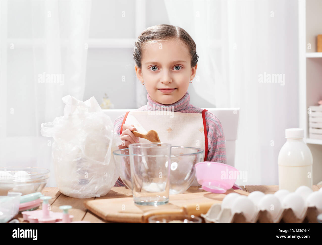 Portrait of girl In kitchen making pastries Stock Photo - Alamy