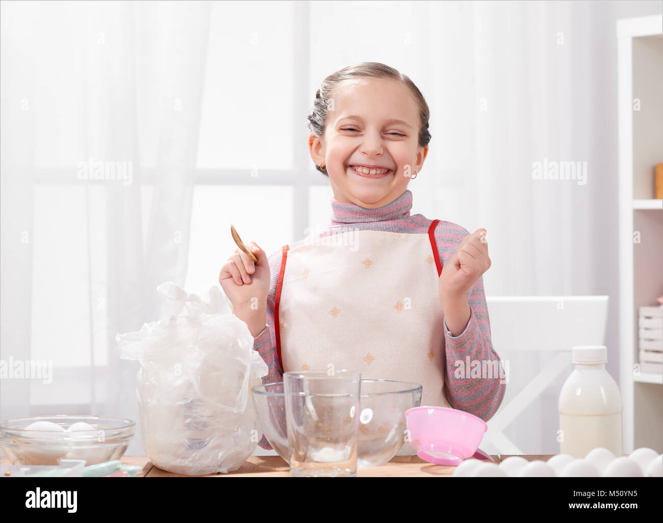 Portrait of girl In kitchen making pastries Stock Photo - Alamy