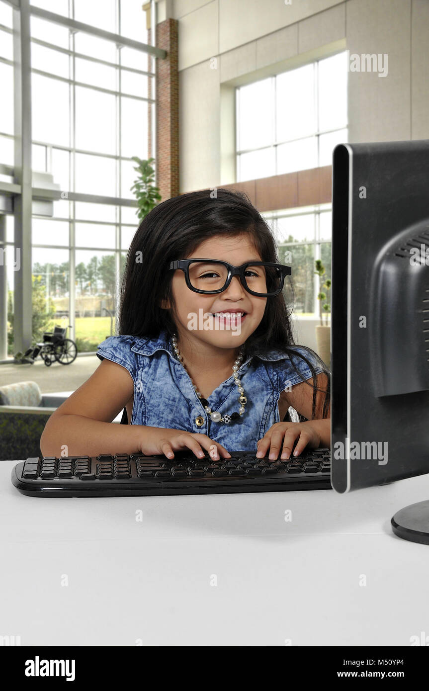 Little Girl Using Computer Stock Photo - Alamy
