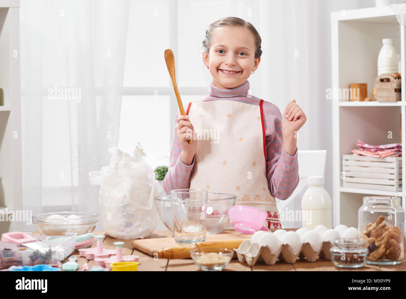 Portrait of girl In kitchen making pastries Stock Photo - Alamy