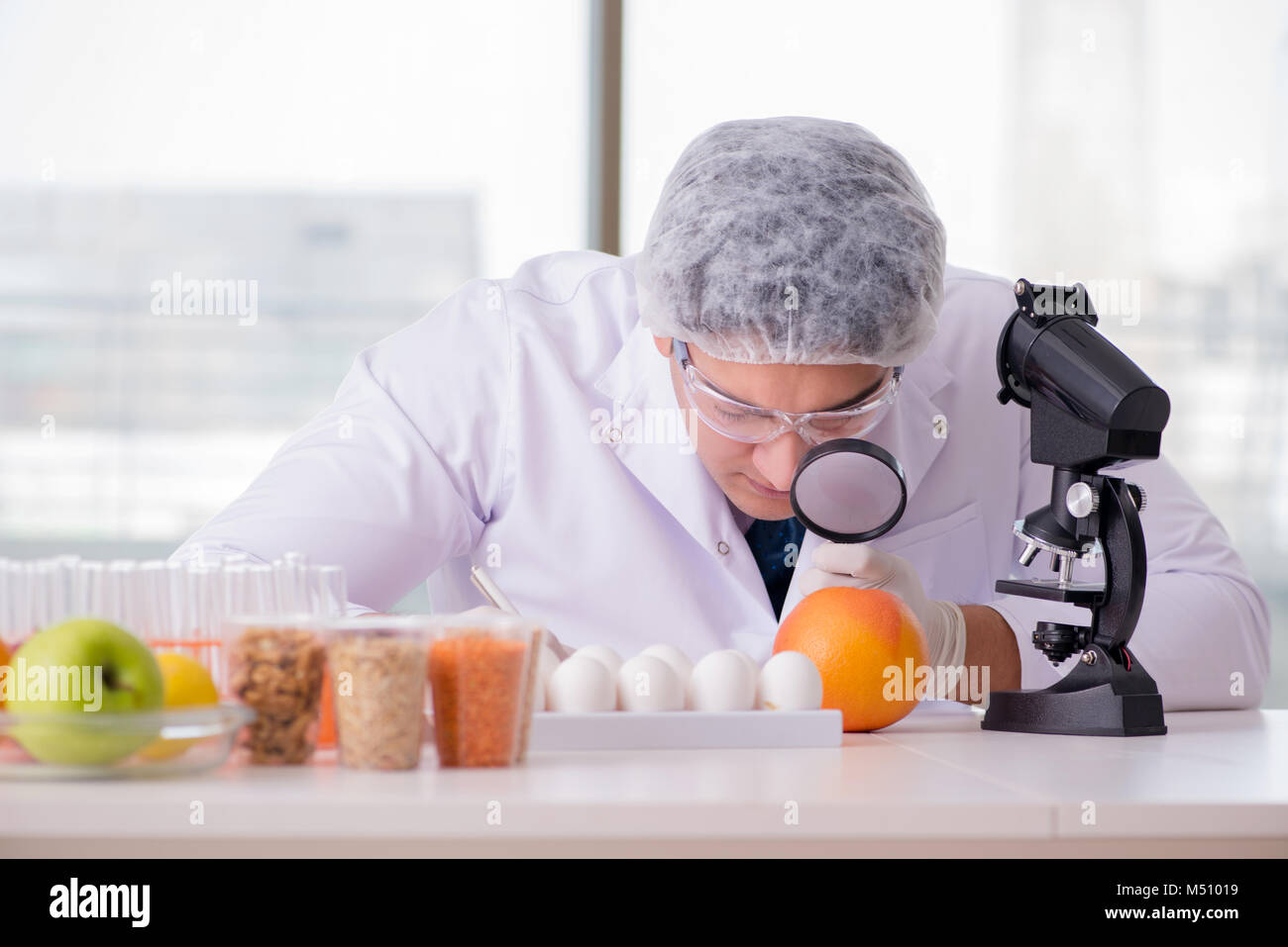 Nutrition expert testing food products in lab Stock Photo - Alamy