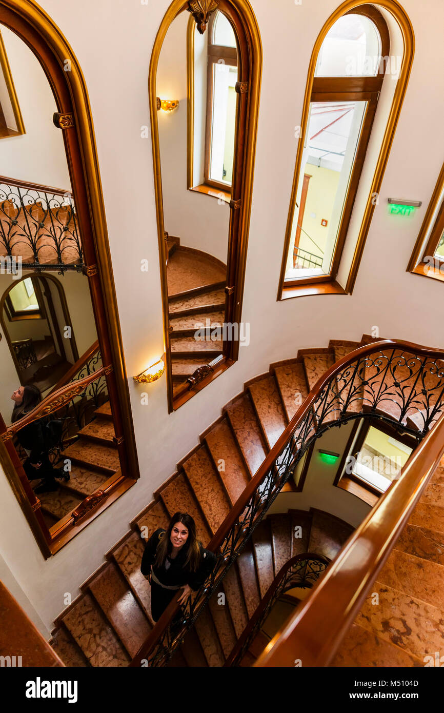 woman on the stairs inside the classic building Stock Photo - Alamy
