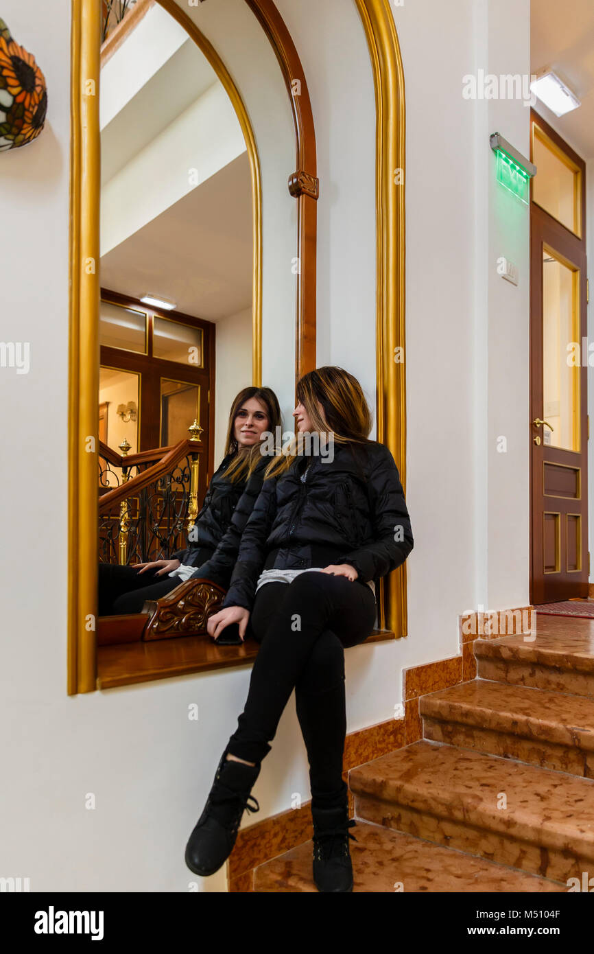 Stylish woman on spiral stairs hi-res stock photography and images - Alamy