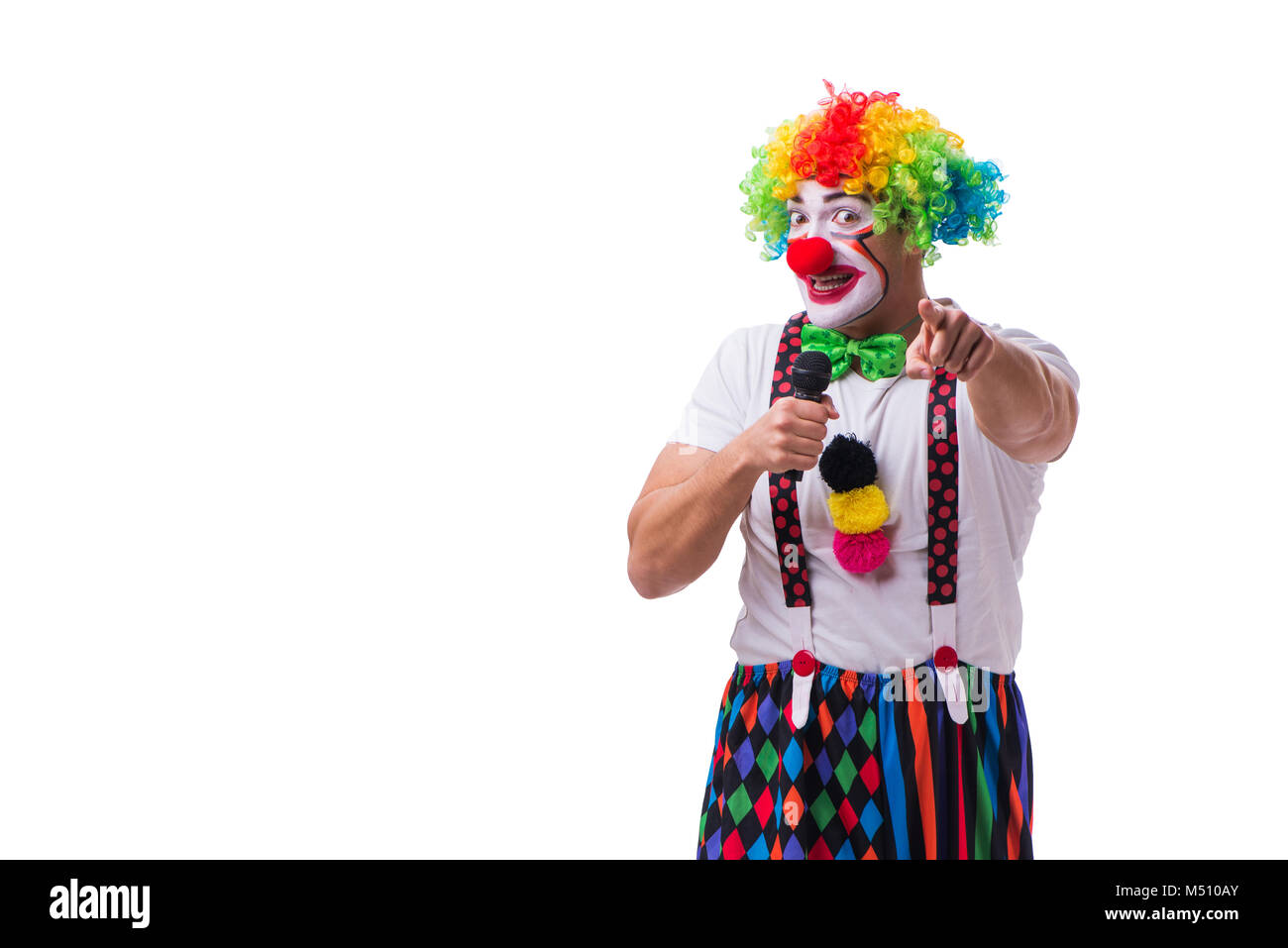 Funny clown with a microphone singing karaoke isolated on white Stock ...