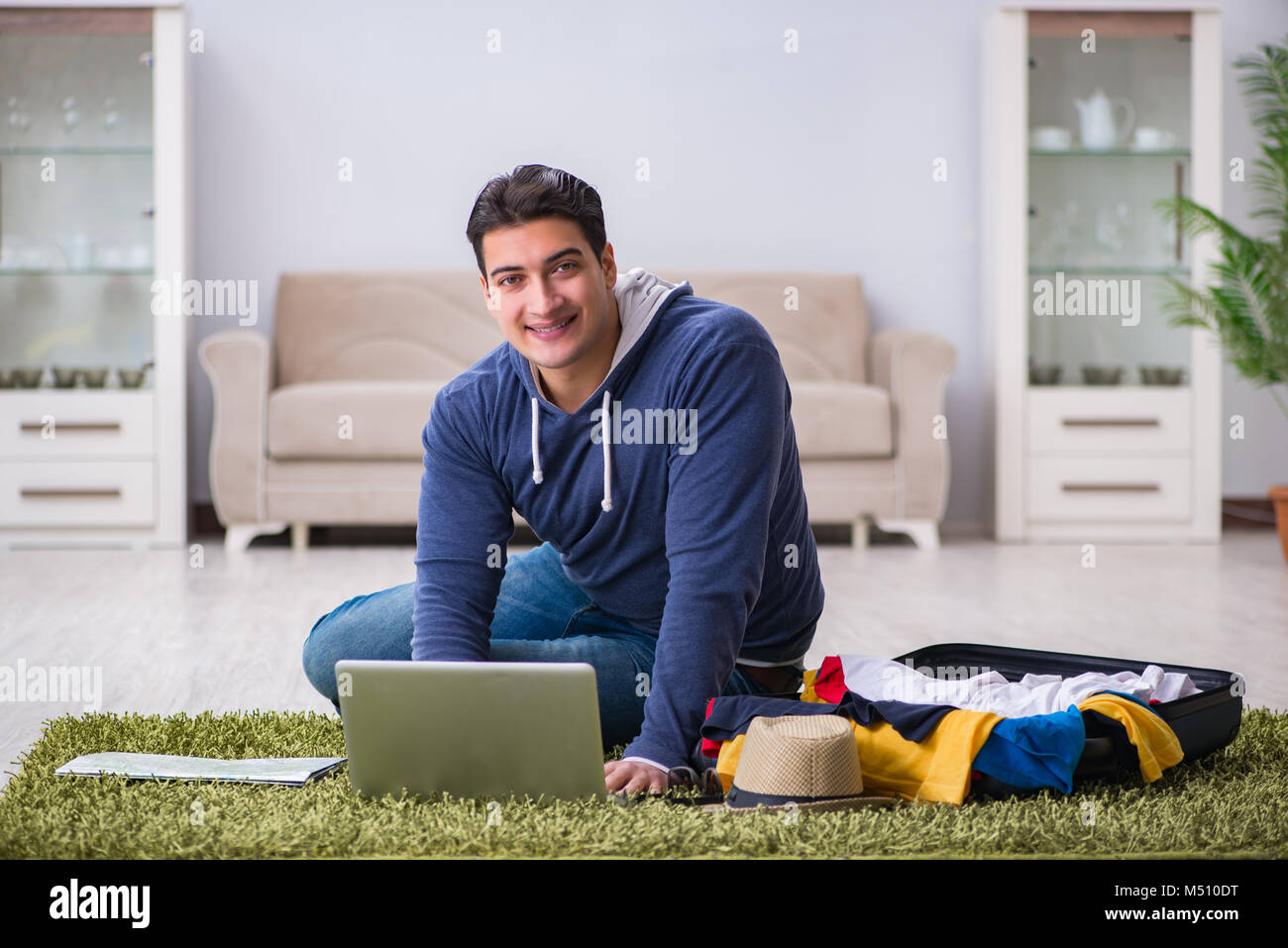 Man planning his vacation trip with map Stock Photo - Alamy