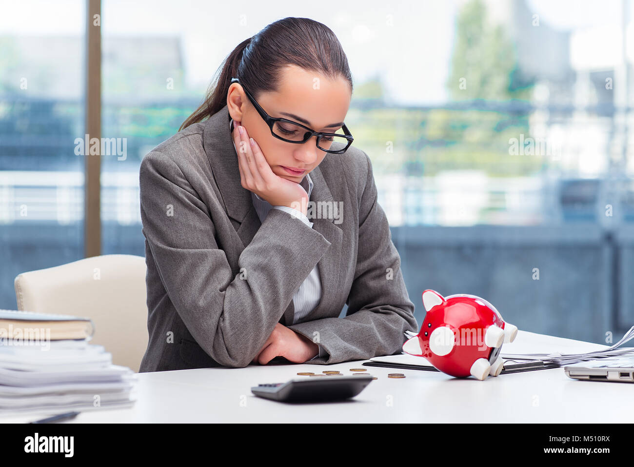 Bankrupt broke businesswoman with piggy bank Stock Photo - Alamy