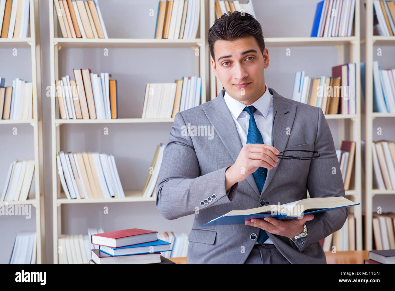 Business law student working studying in the library Stock Photo - Alamy