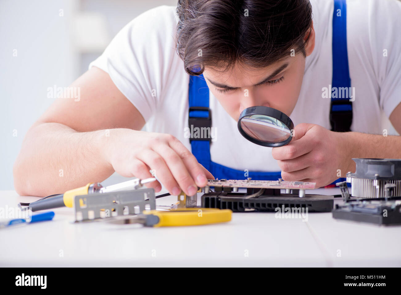Computer repairman repairing desktop computer Stock Photo - Alamy