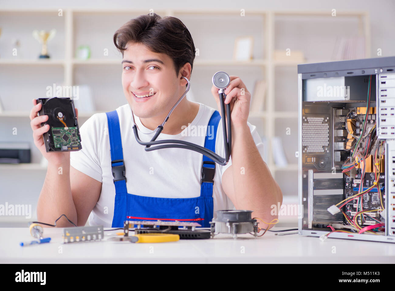 Computer repairman repairing desktop computer Stock Photo - Alamy