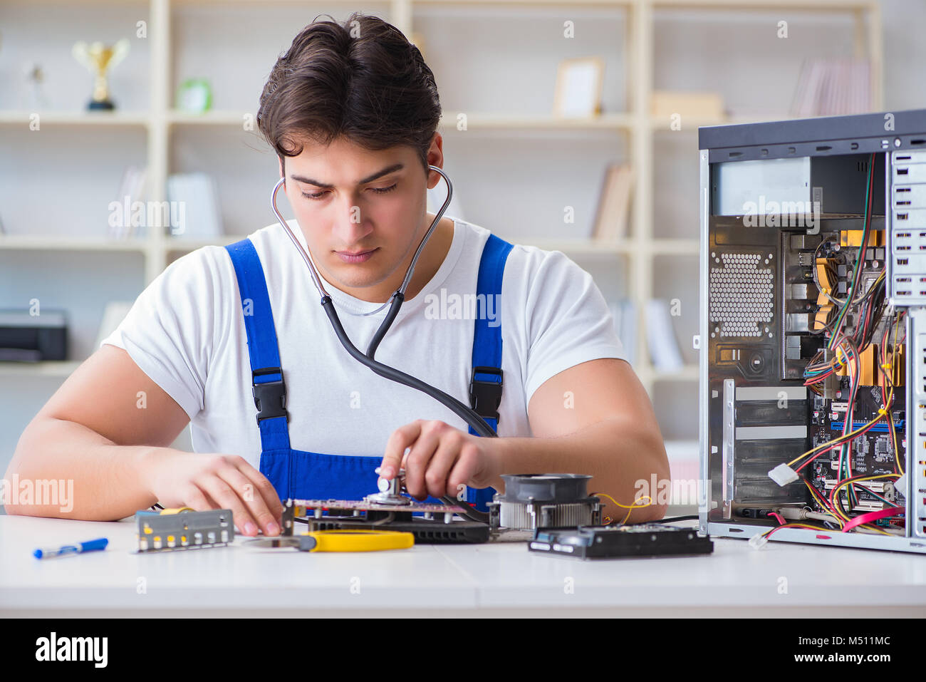 Computer repairman repairing desktop computer Stock Photo - Alamy