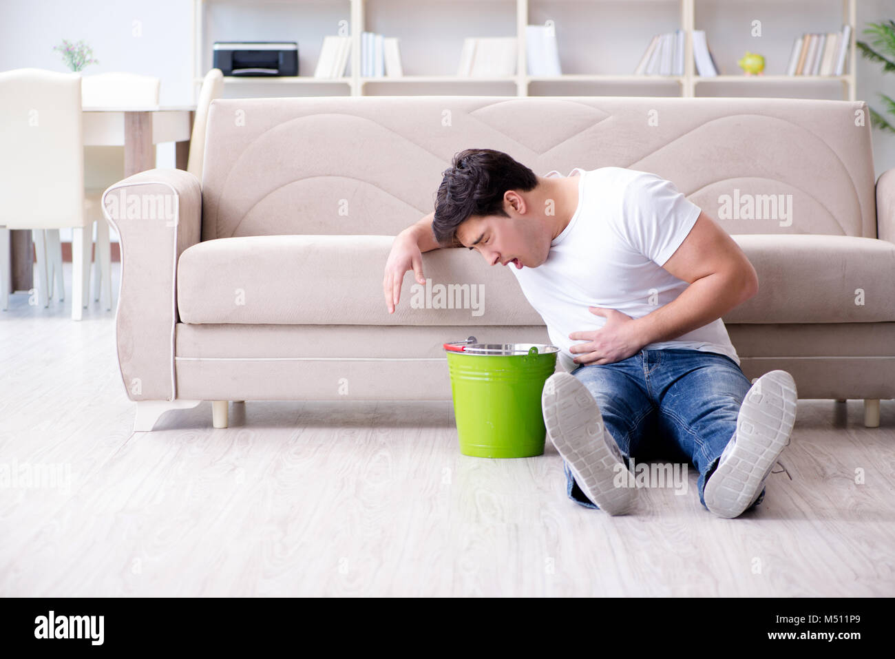 Man vomiting bucket hi-res stock photography and images - Alamy
