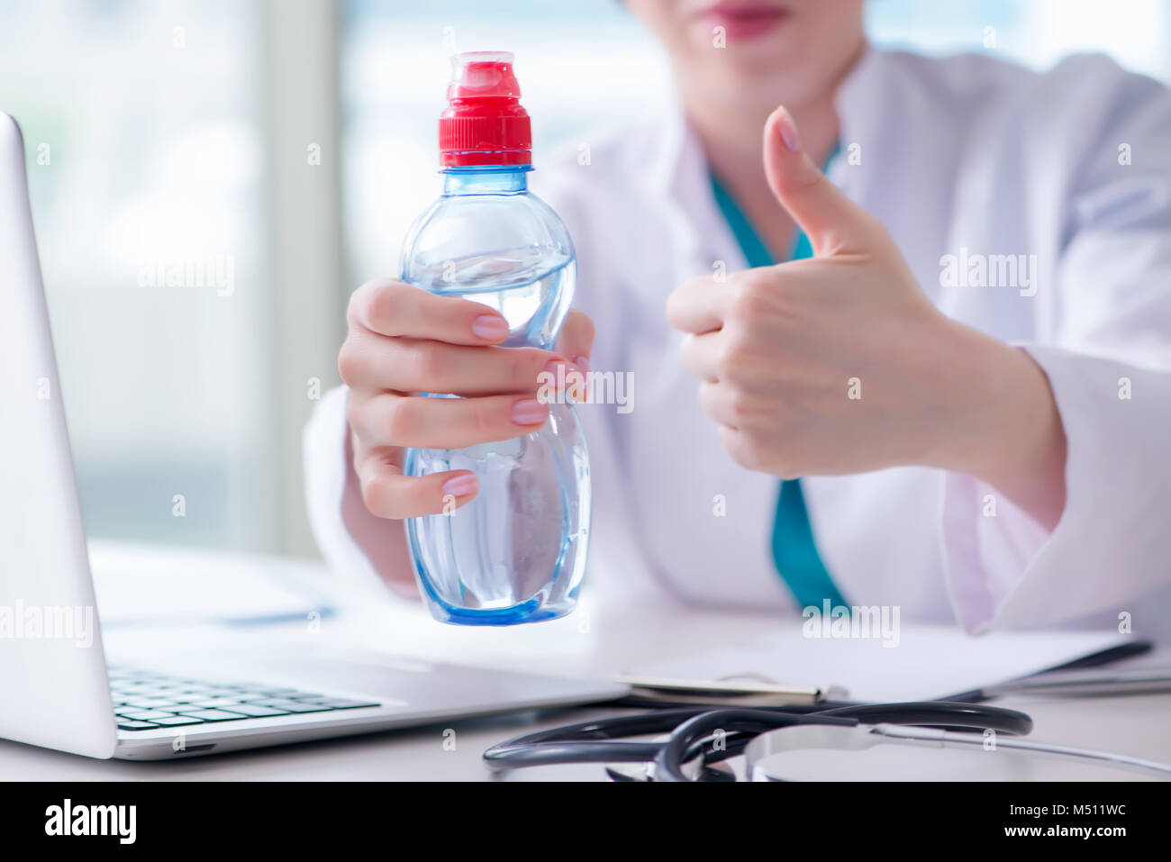 Doctor hand with fresh water in medical concept Stock Photo - Alamy