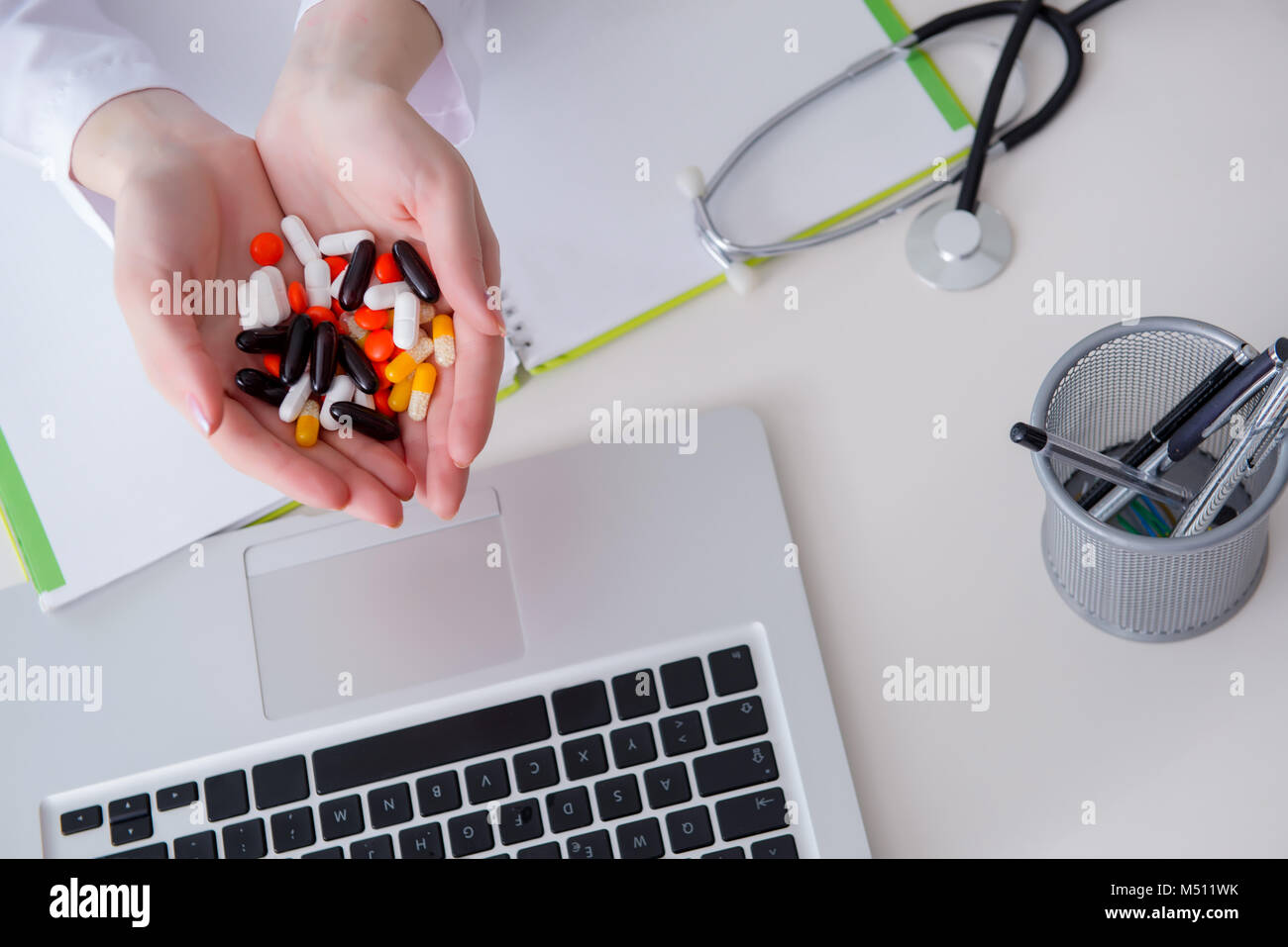 Medical concept with medicines and laptop computer Stock Photo - Alamy