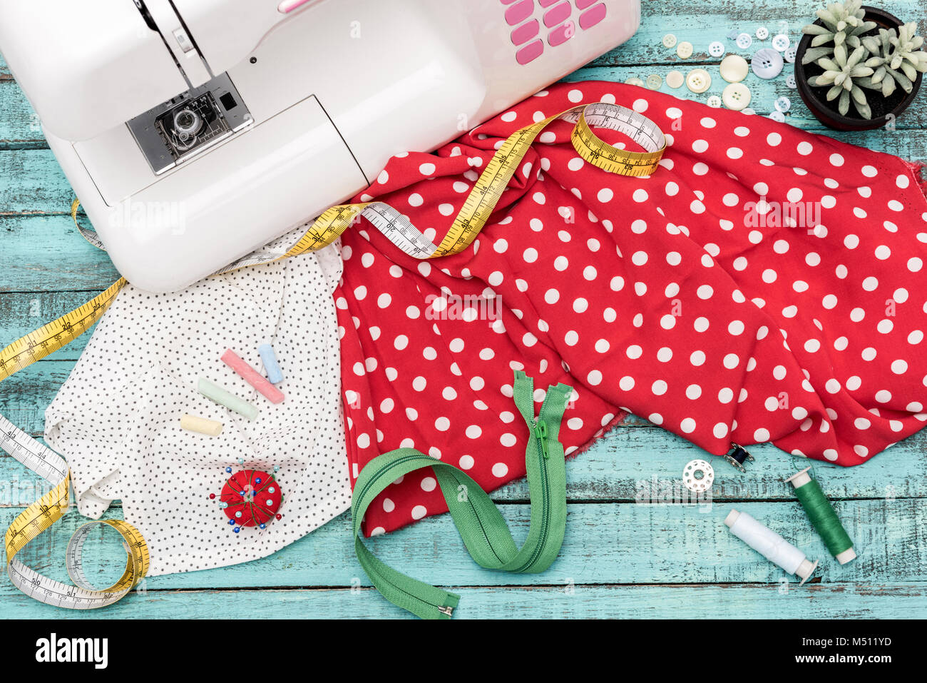 arranged tailoring equipment on wooden table Stock Photo - Alamy