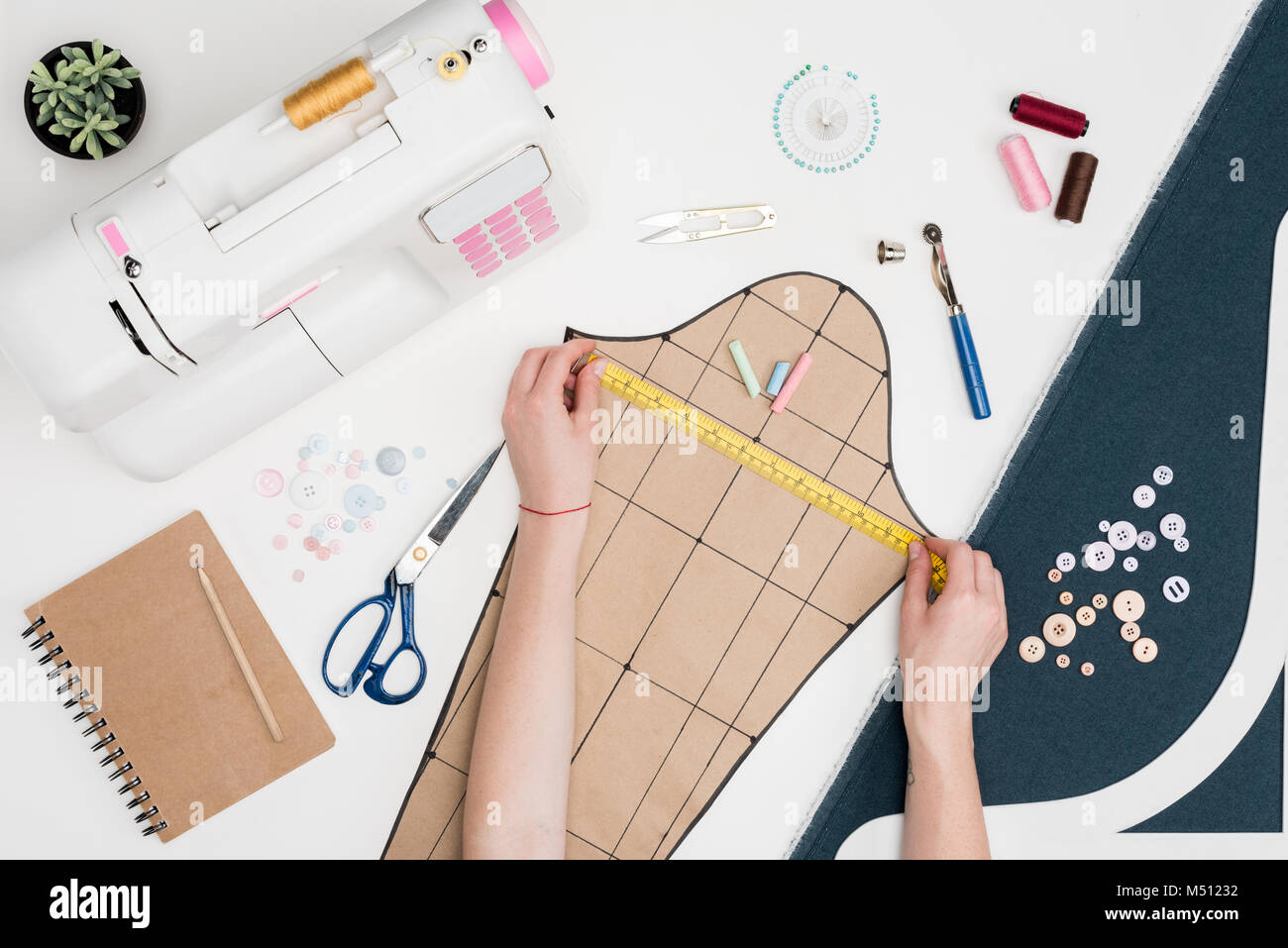 tailor measuring cutting sheet Stock Photo - Alamy