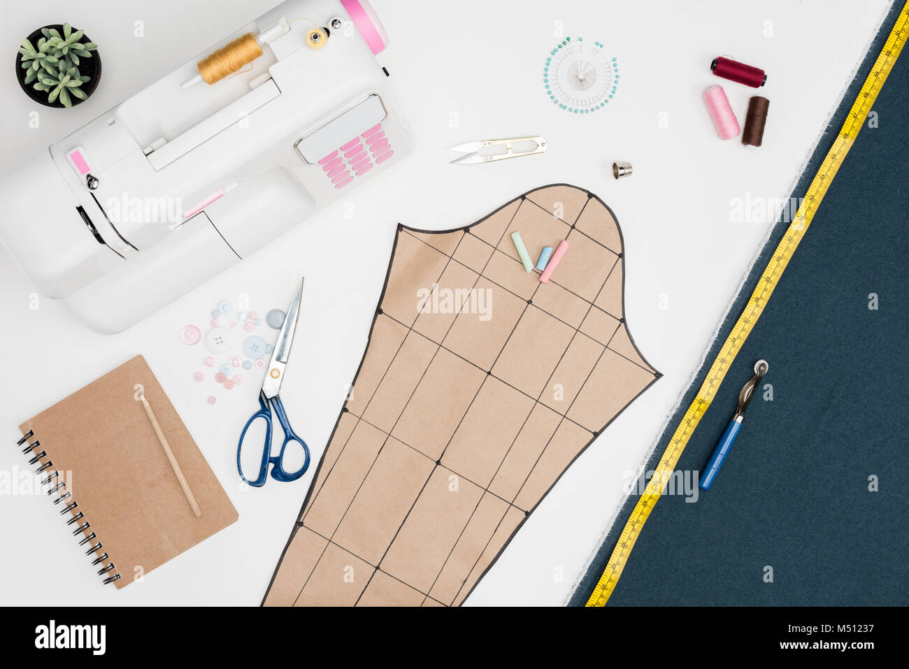 cutting sheet and tailoring equipment Stock Photo - Alamy