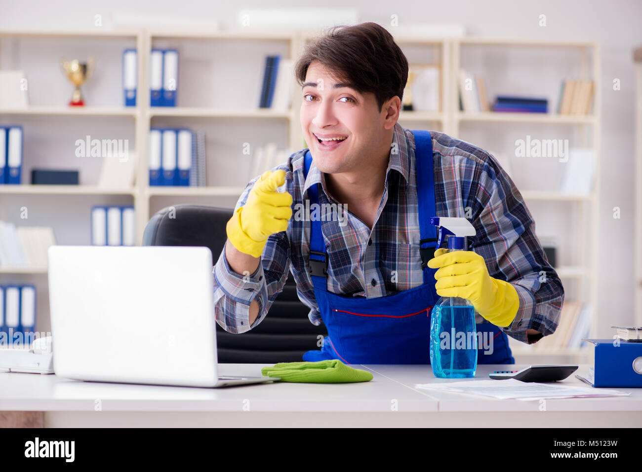 Male cleaner working in the office Stock Photo - Alamy