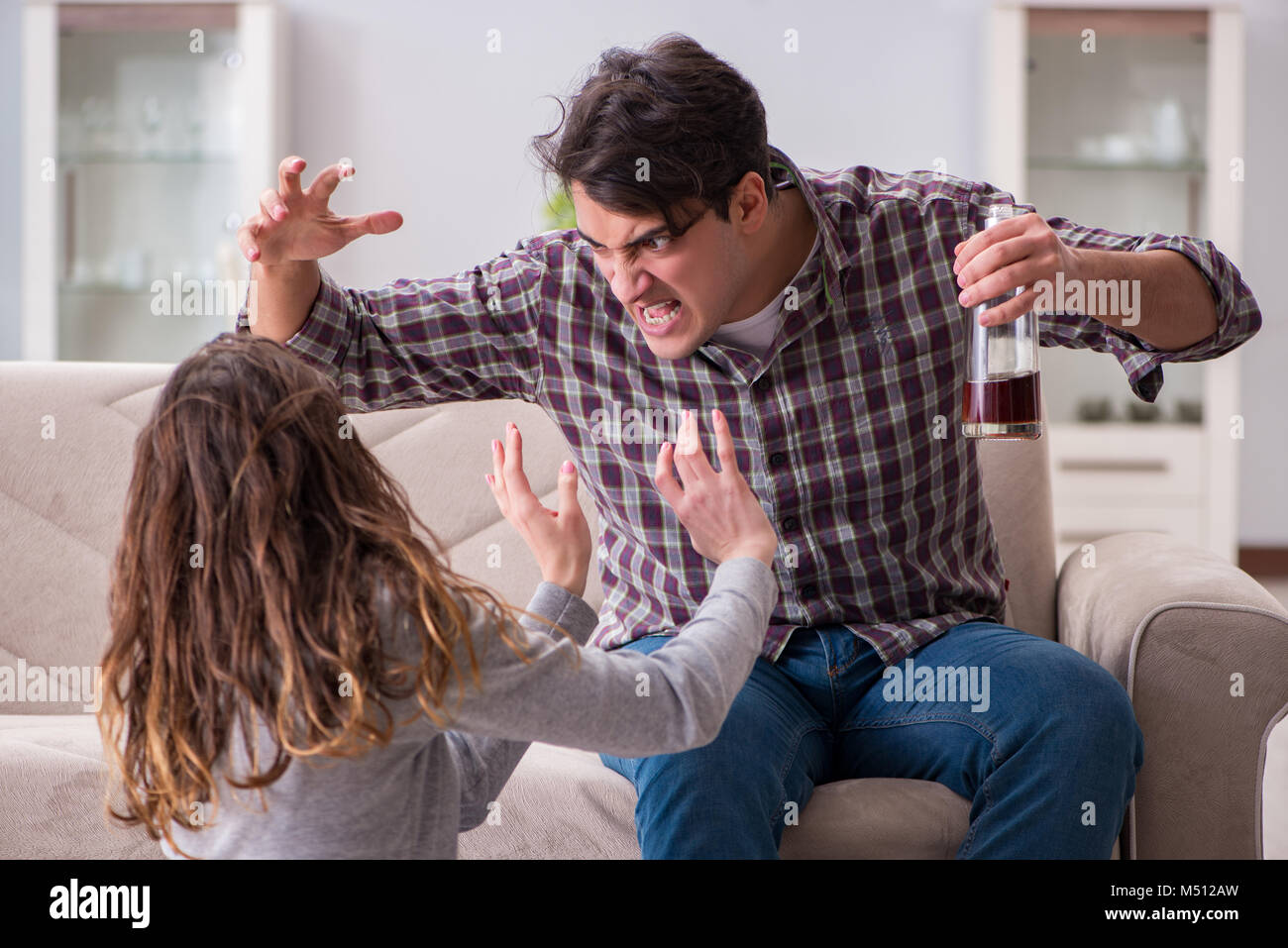 Domestic violence concept in a family argument with drunk alcoho Stock ...