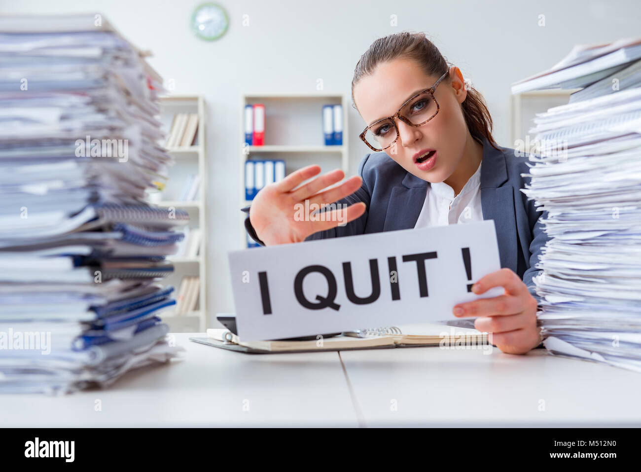 Businesswoman not coping with workload and resigning Stock Photo - Alamy