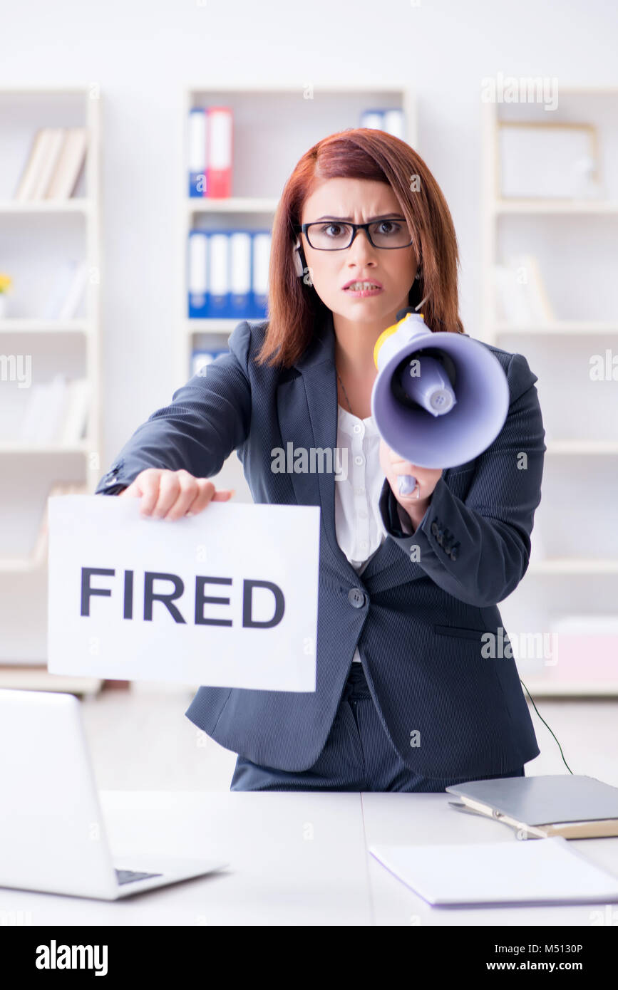 Businesswoman firing people in office Stock Photo - Alamy
