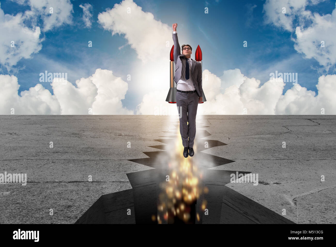 Businessman flying on rocket from rock gap Stock Photo - Alamy