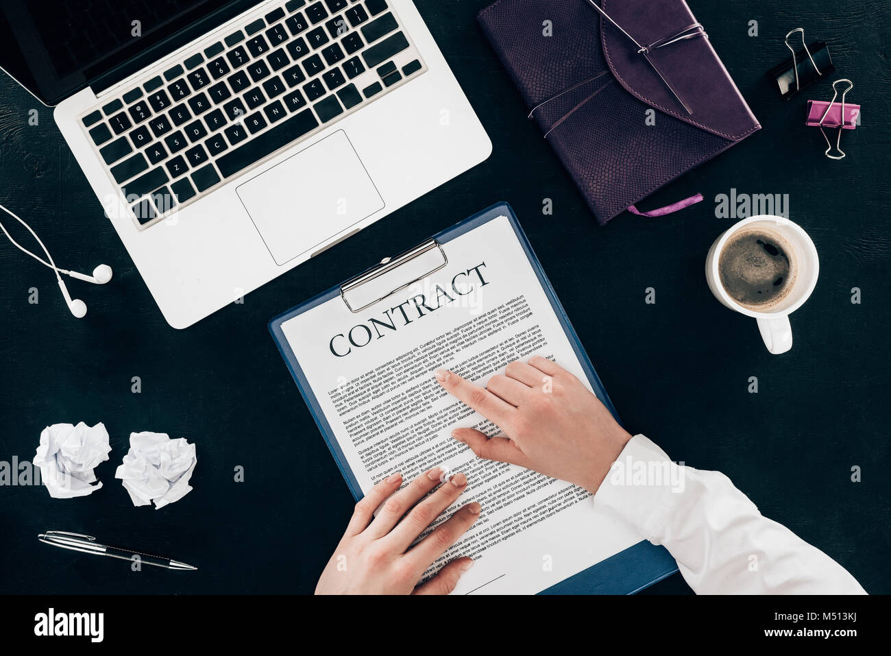 cropped shot of businesswoman reading contract at workplace isolated on ...