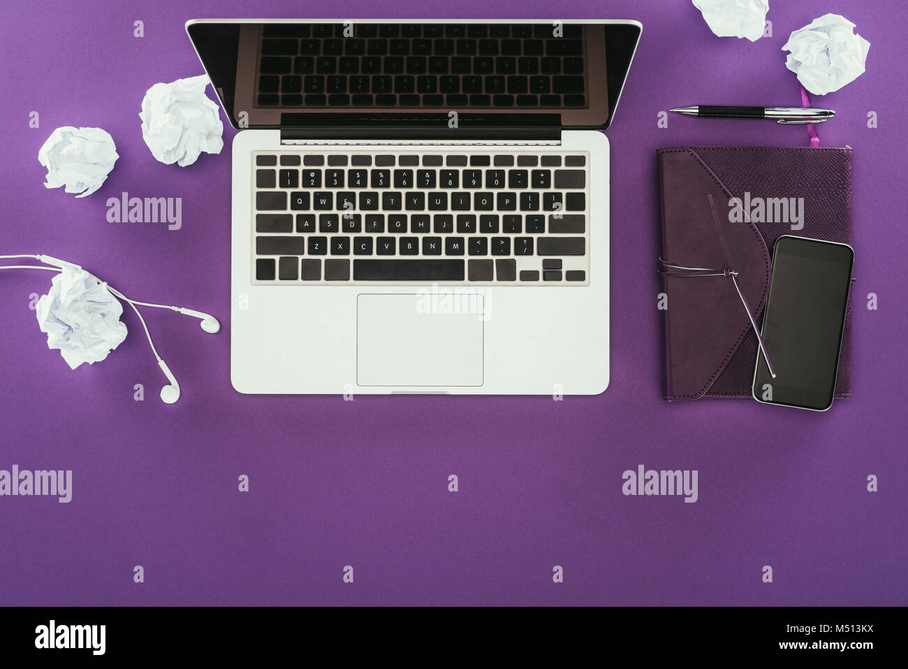 top view of messy business workplace on purple surface Stock Photo - Alamy