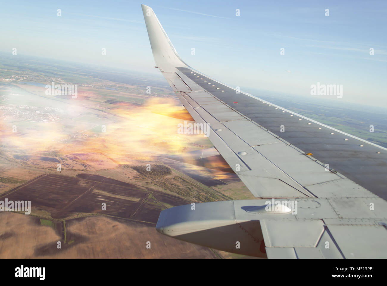 Burning Wing Of The Plane The Plane Falling The View From The Window Of The Aircraft The