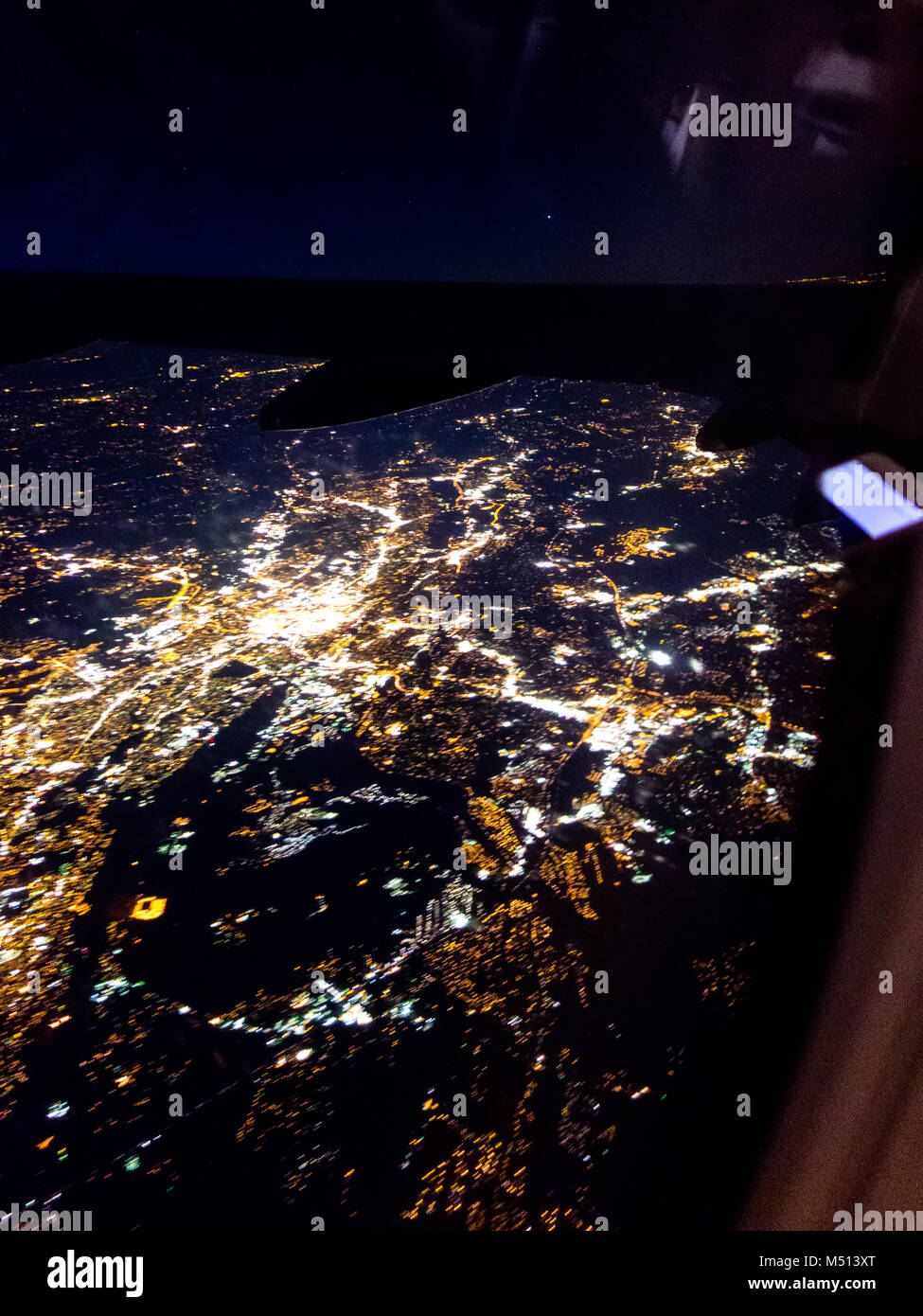 flying at night over cities below Stock Photo - Alamy