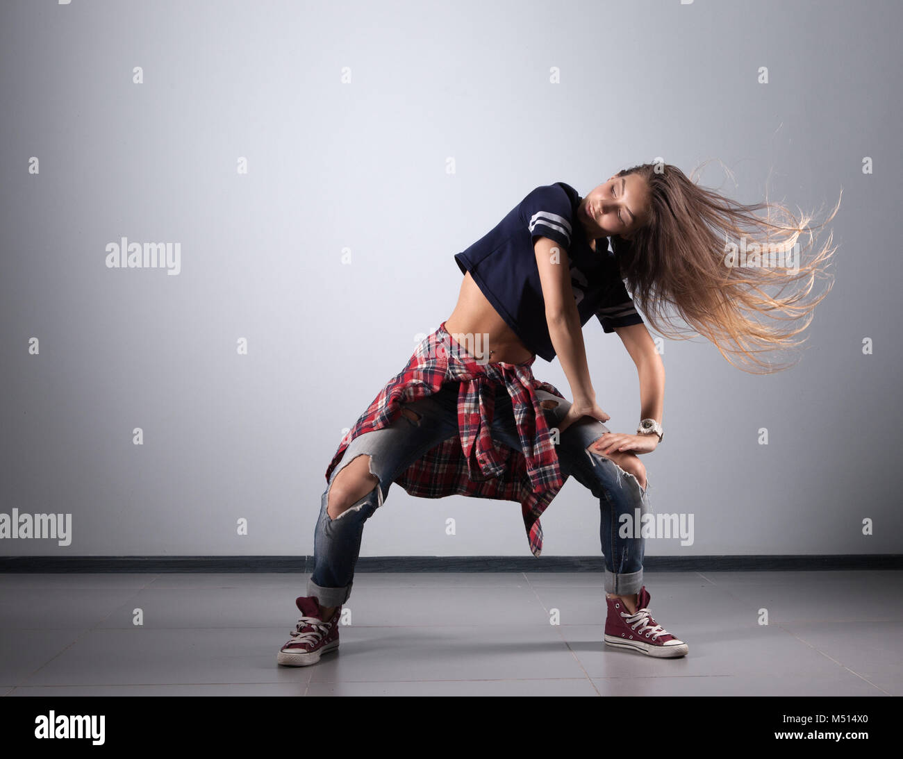 modern young beautiful dancer posing on a studio background Stock Photo ...