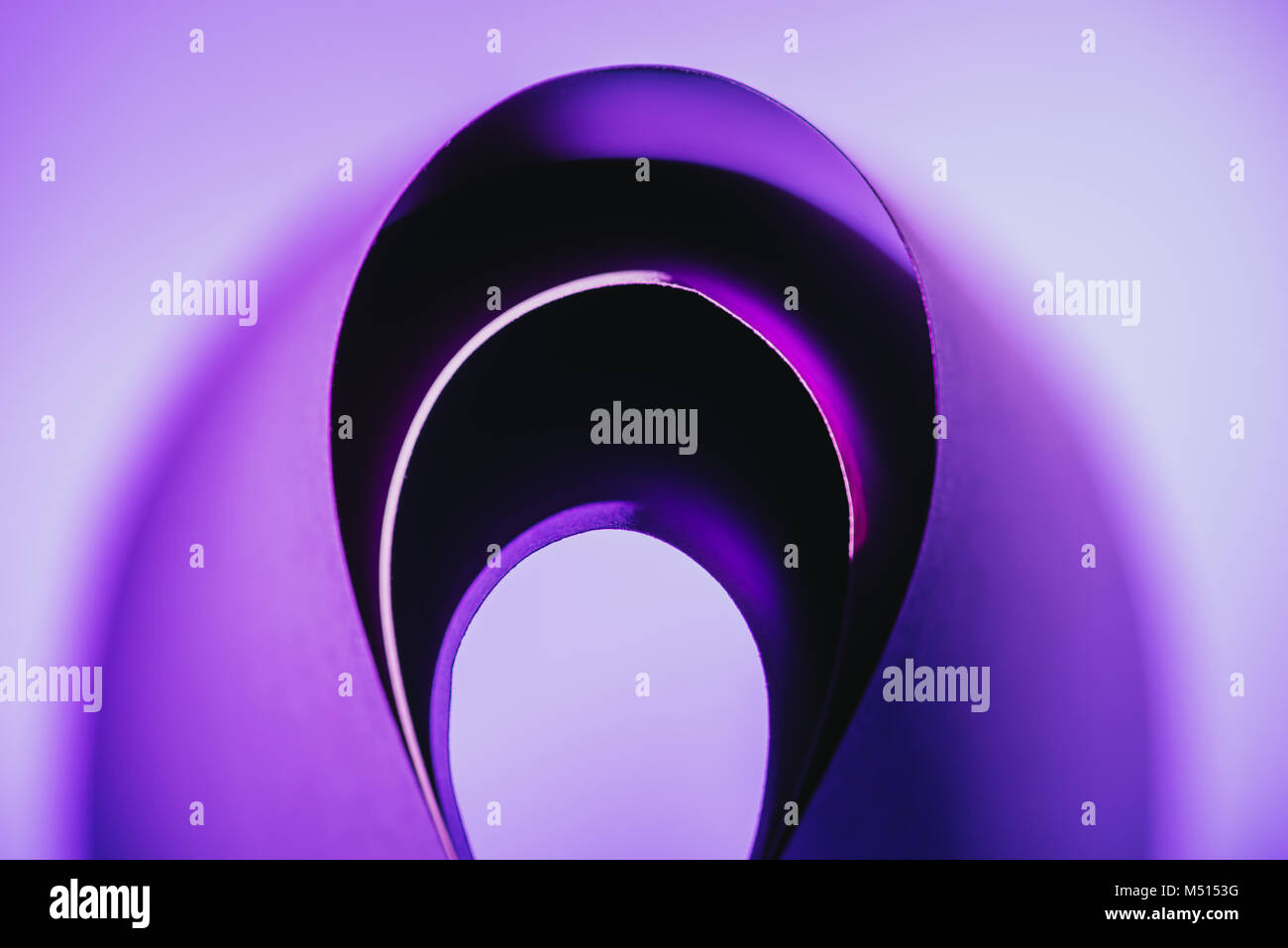 arcs of warping purple paper on purple Stock Photo - Alamy