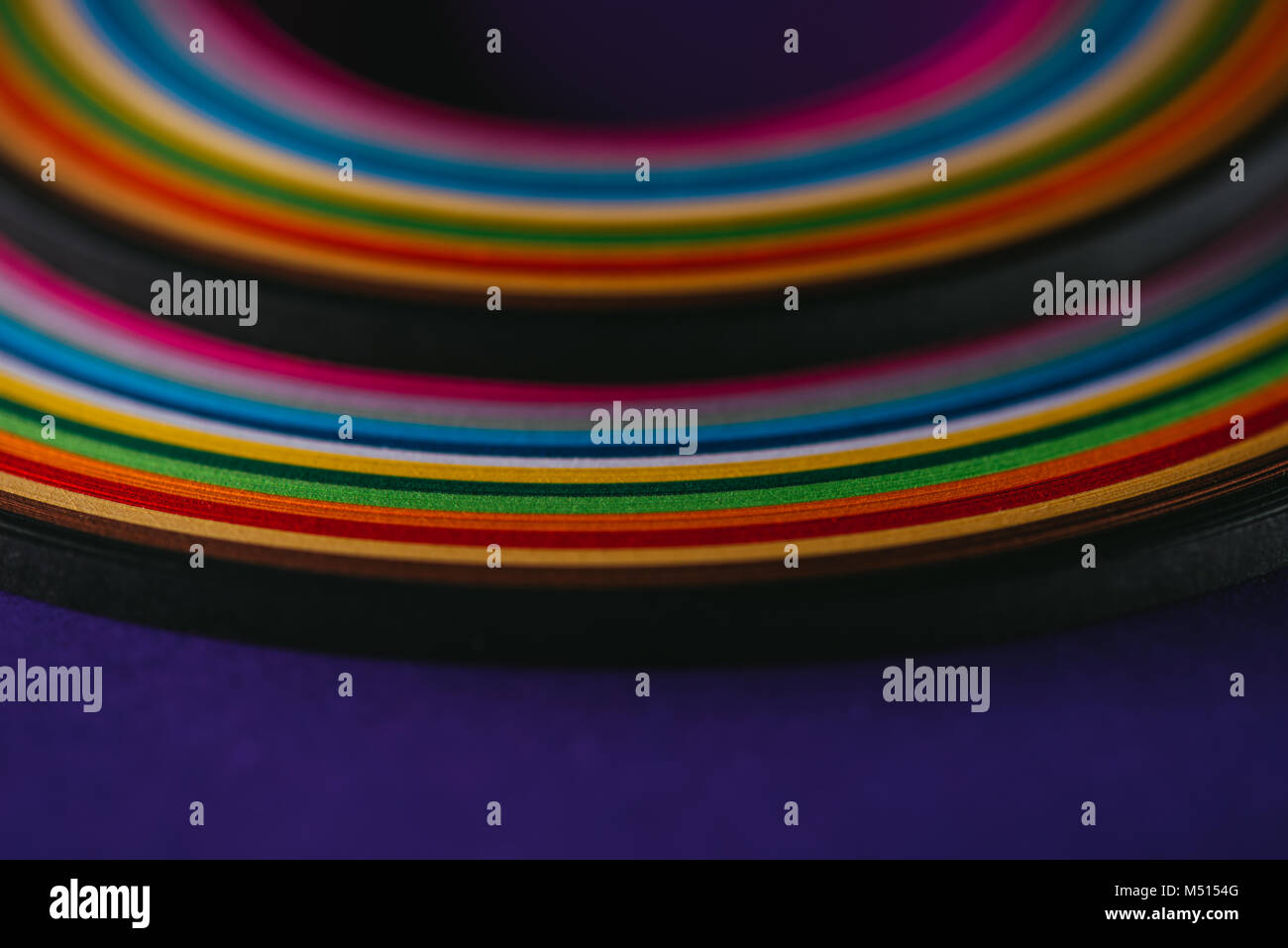 colored quilling paper curves on purple Stock Photo - Alamy