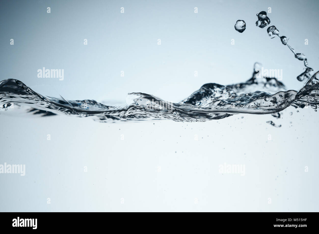 minimalistic background with clear flowing water, isolated on white ...