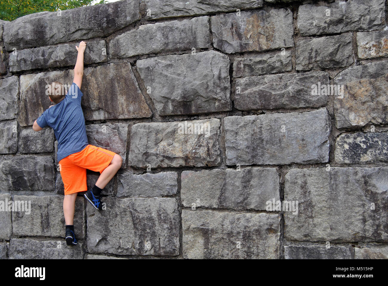 Child moving rock with finger hi-res stock photography and images - Alamy