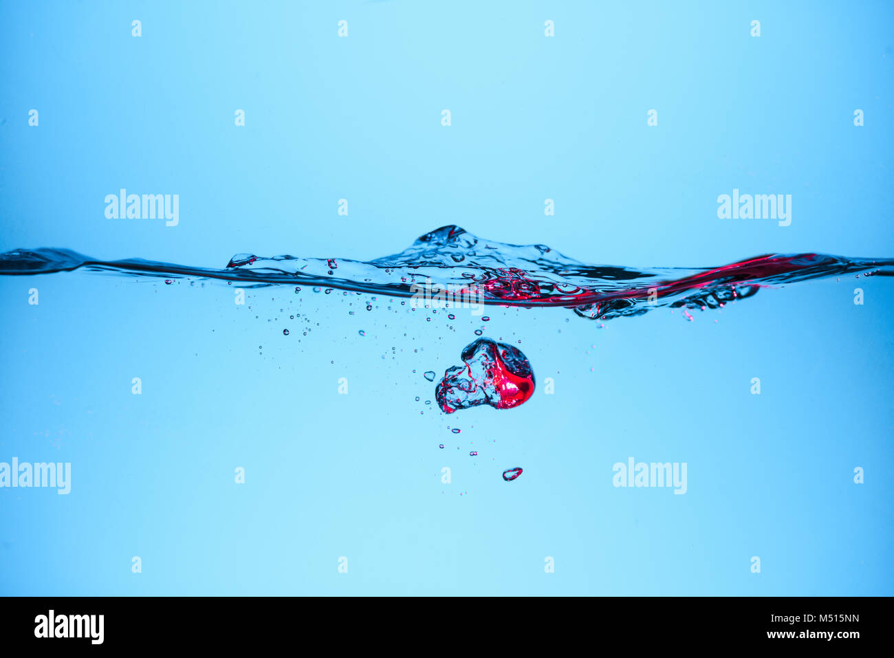 bubbles in pure water, isolated on blue Stock Photo - Alamy