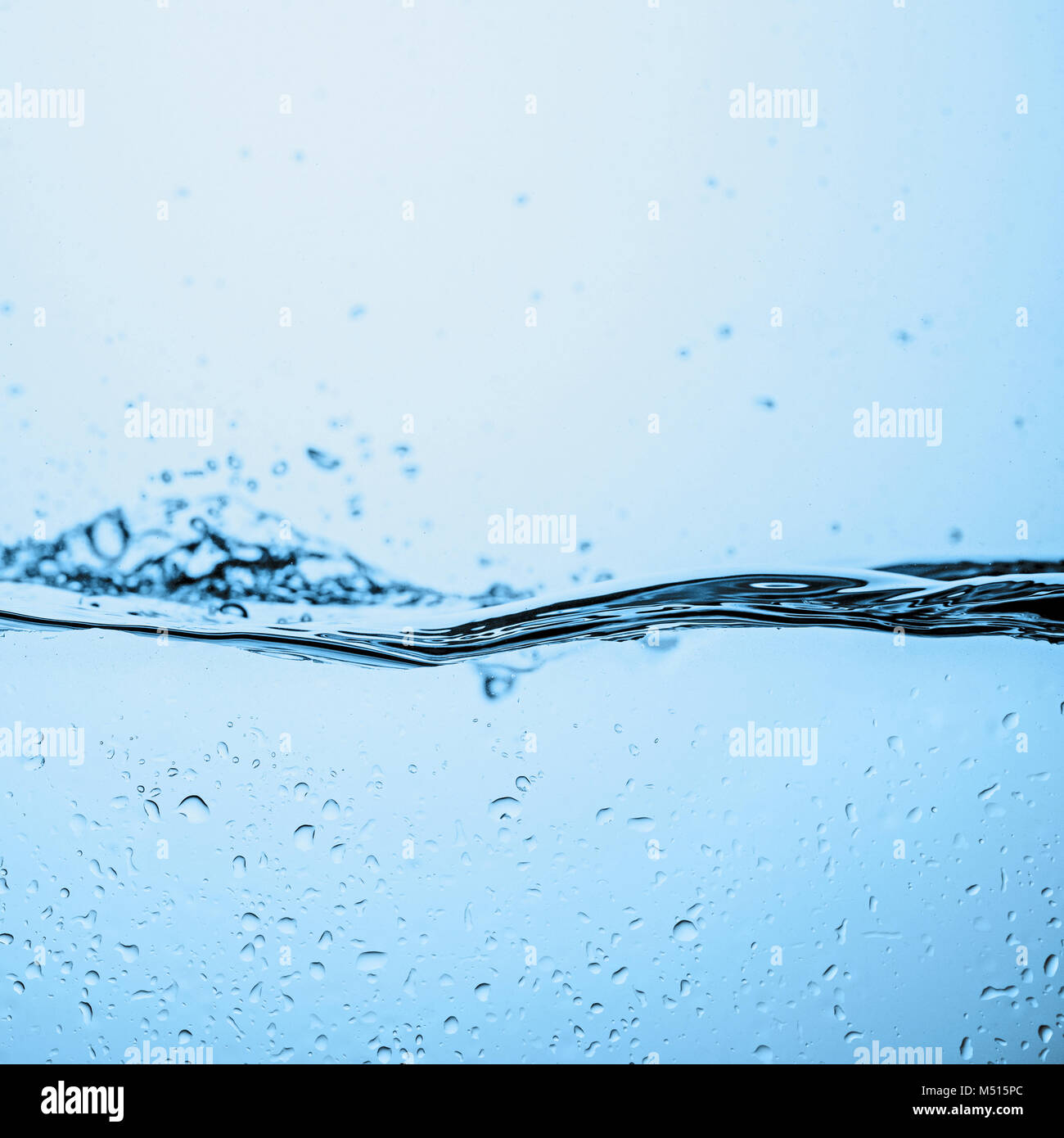 flowing water background with drops, isolated on white Stock Photo - Alamy