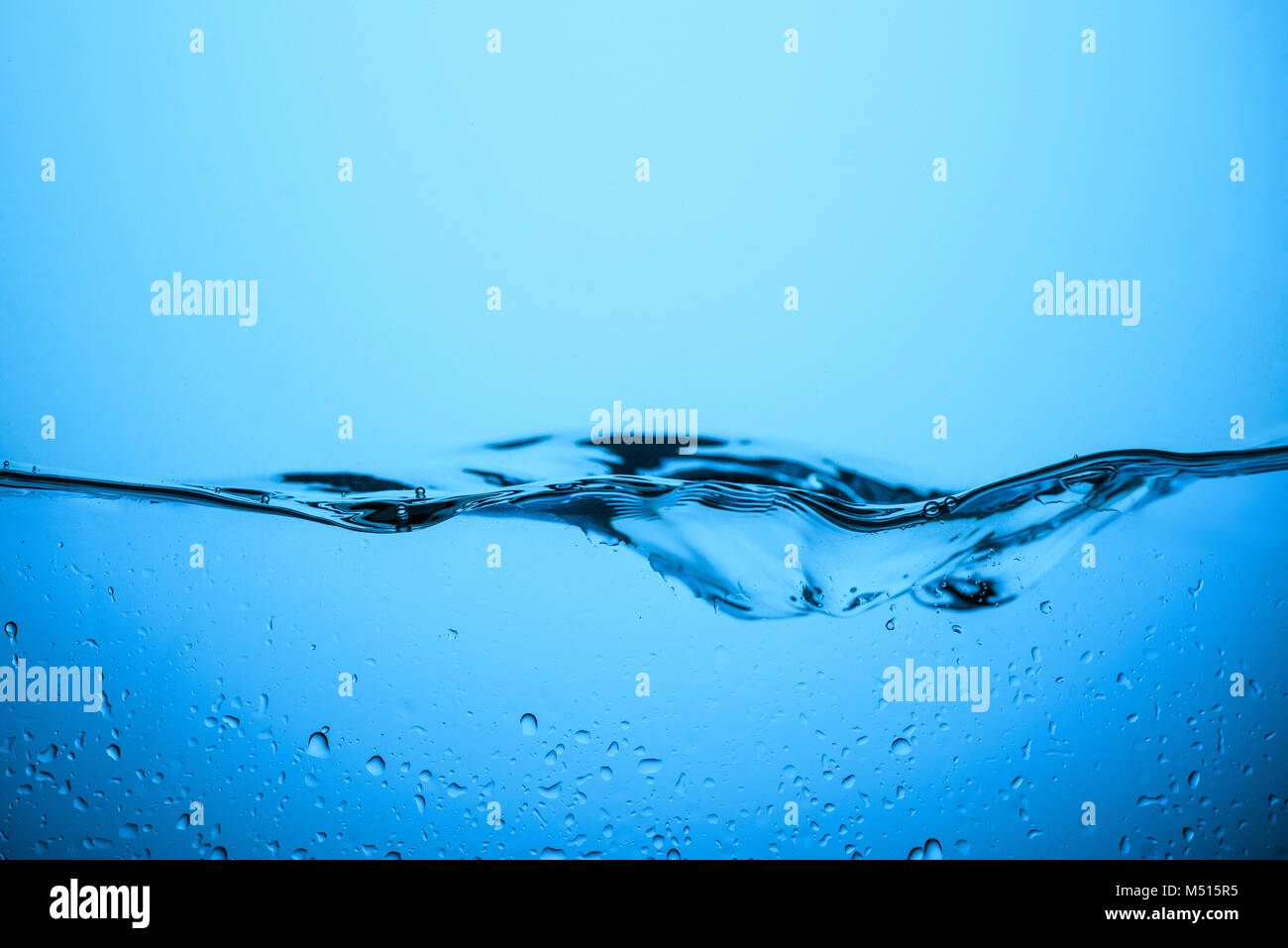 clear water texture with drops, isolated on blue Stock Photo - Alamy