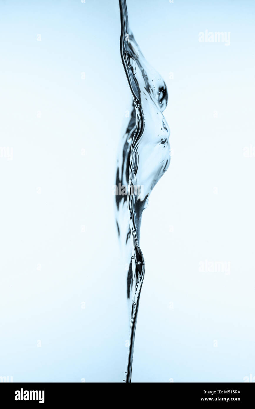 pouring clear water, isolated on white Stock Photo - Alamy