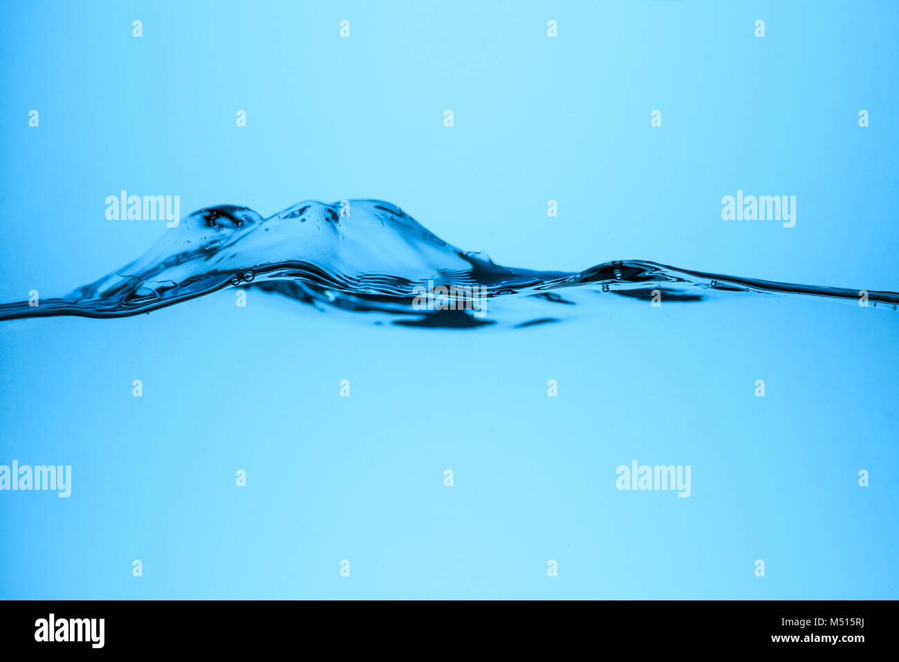 pure flowing water texture, isolated on blue Stock Photo - Alamy