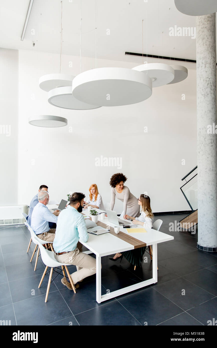 View at business people around table during staff meeting in the office ...