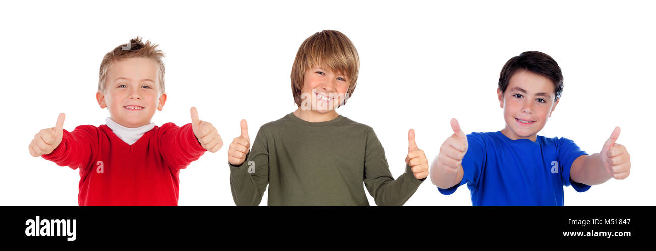 Happy children saying Ok with their thumbs isolated on a white ...