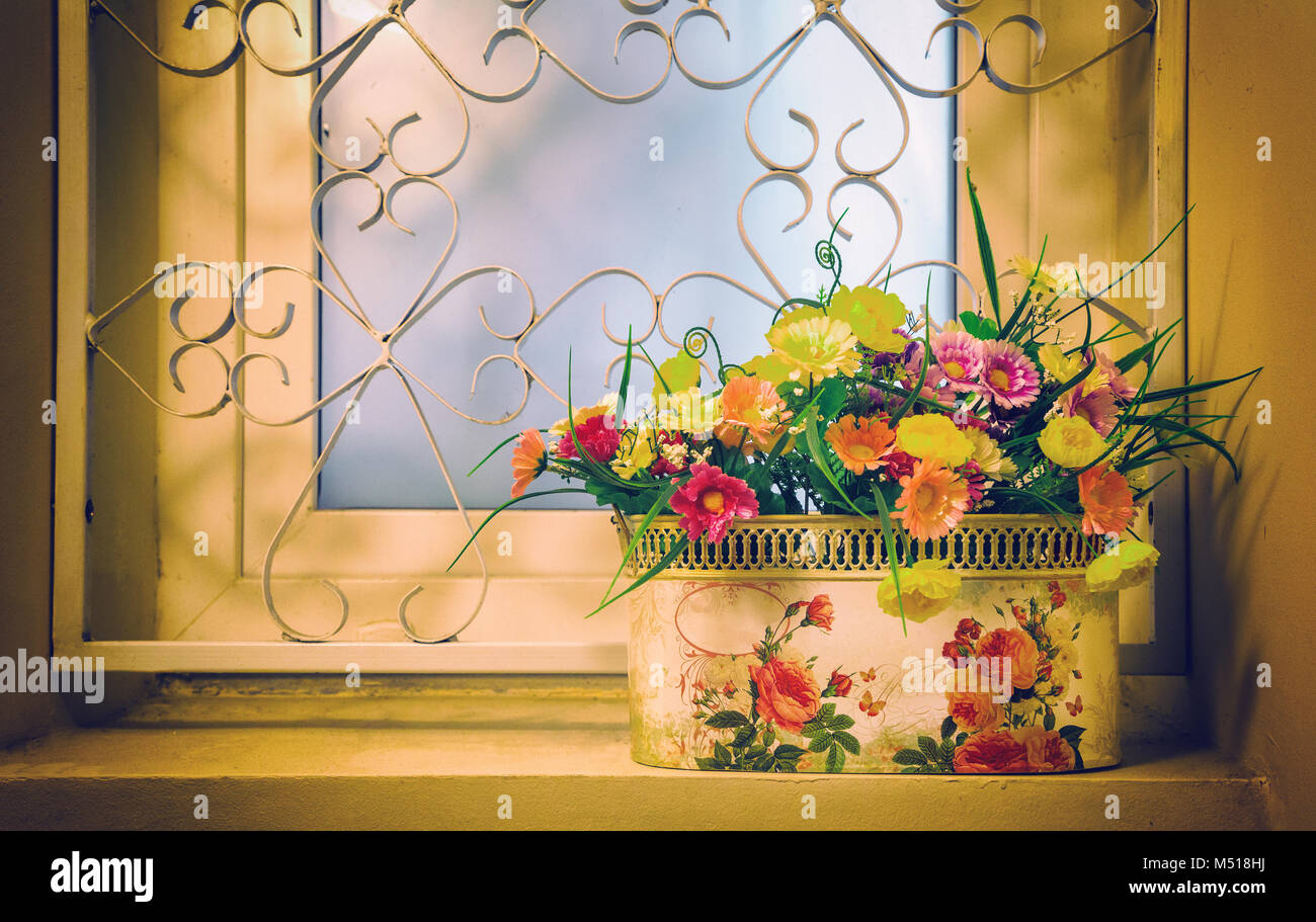 Pot of flowers on the window Stock Photo - Alamy