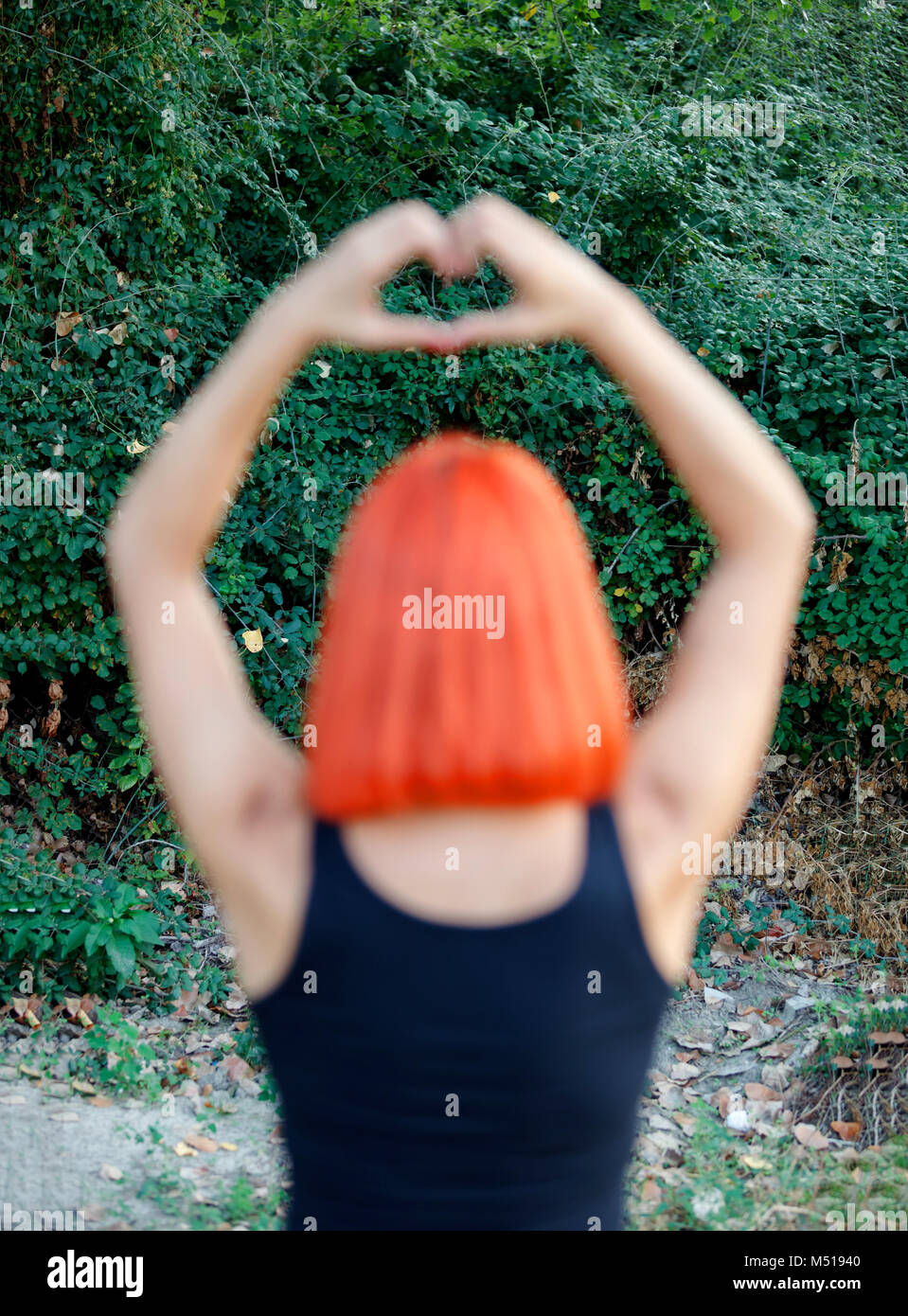 Girl making a heart shape symbol for love Stock Photo - Alamy