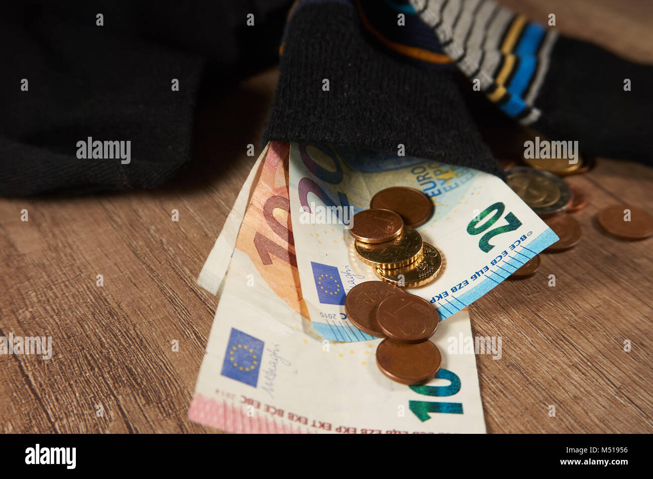 Hiding money in socks is an insecure investment Stock Photo - Alamy