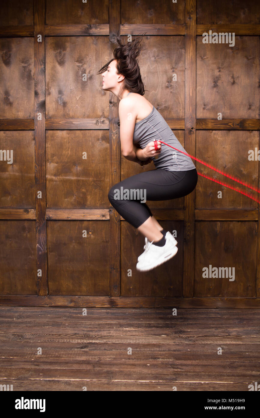 Girl jumping on skipping rope Stock Photo - Alamy